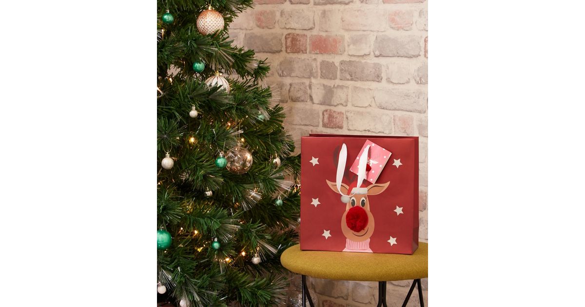 Grand sac cadeau rouge design Rodolphe et à pompons | New Look