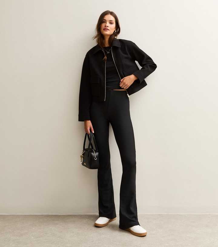 Tall Black Ribbed Flared Trousers | New Look