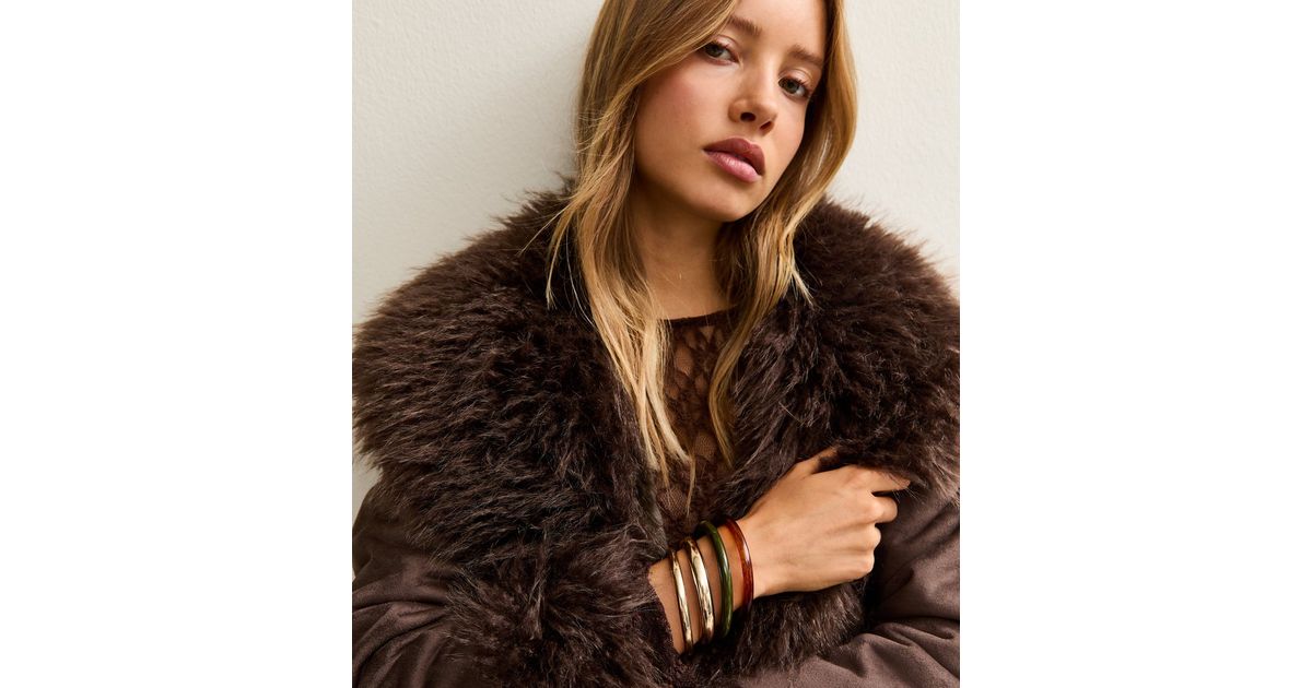 Pack of 4 Gold Tone and Resin Bangles | New Look